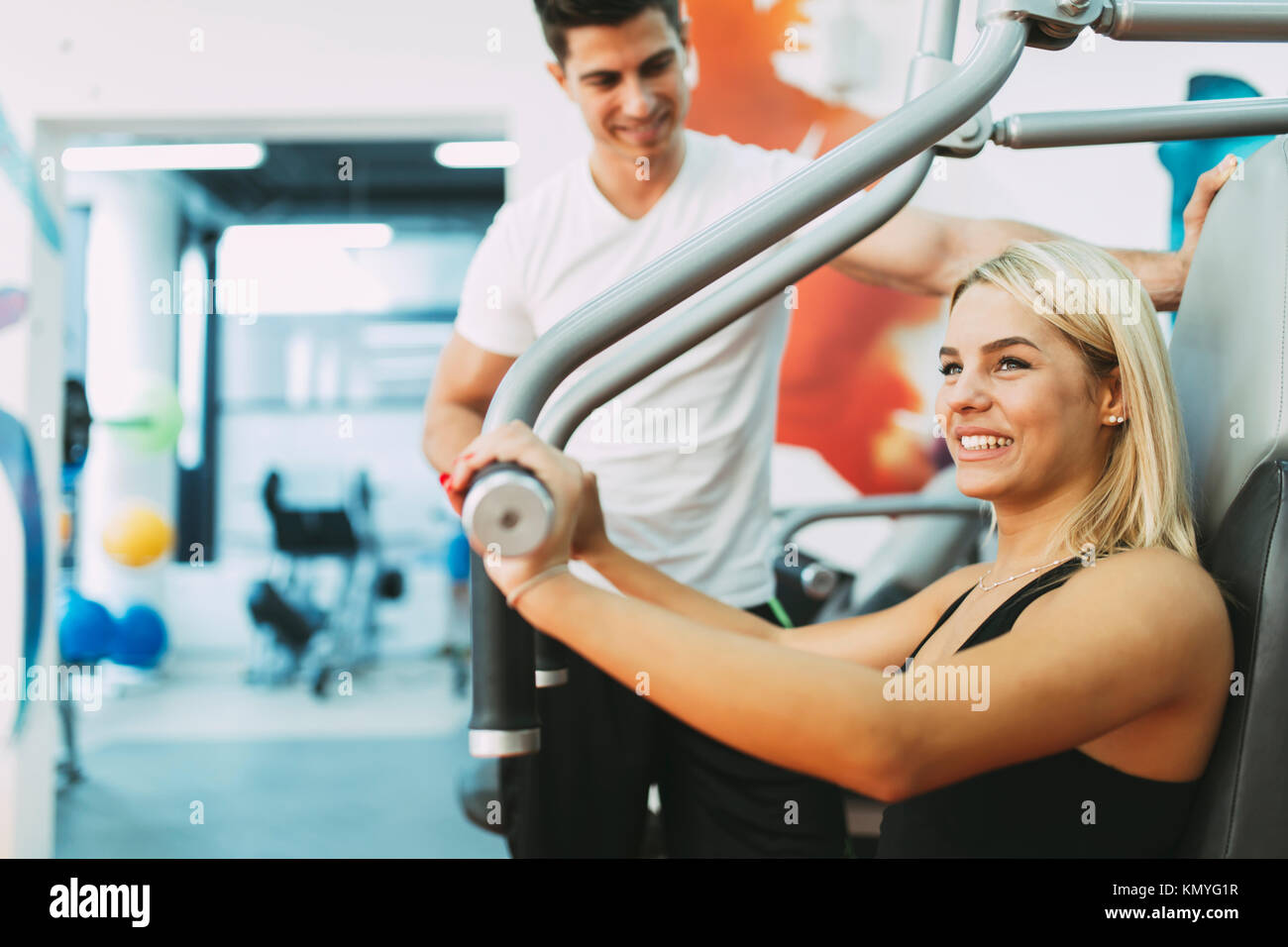 Beautiful woman exercising in gym Stock Photo - Alamy