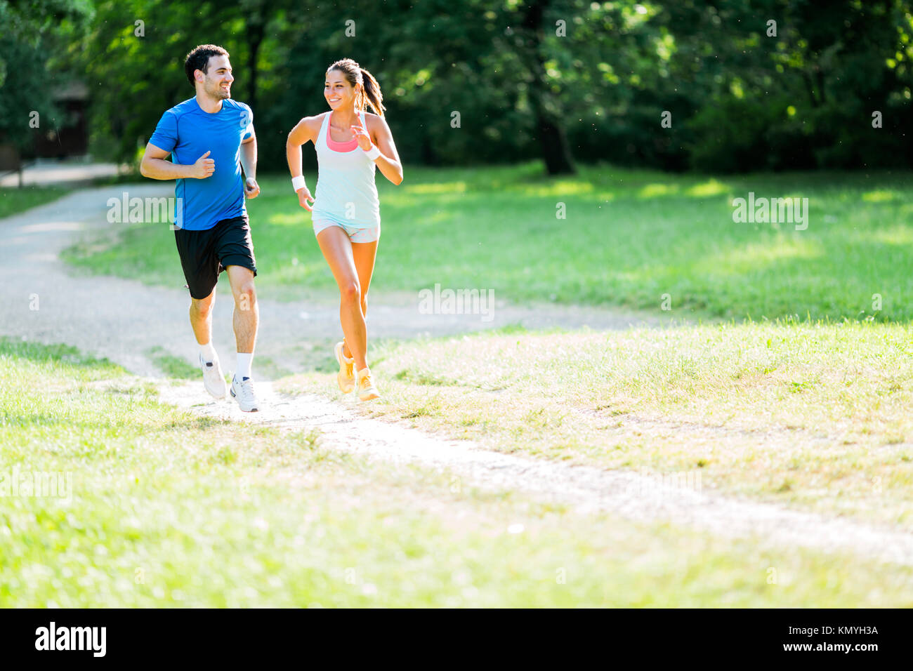 Young people running in nature Stock Photo - Alamy