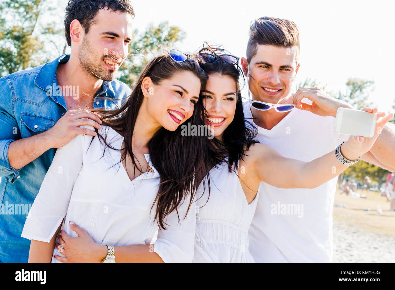Group of cheerful and beautiful young people taking photos of th Stock ...