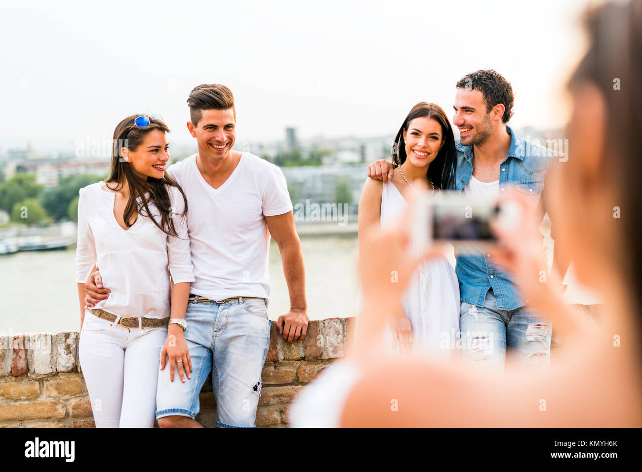 Group of young people being photographed Stock Photo - Alamy