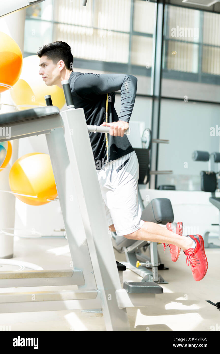 Young handsome man working out in a gym Stock Photo - Alamy