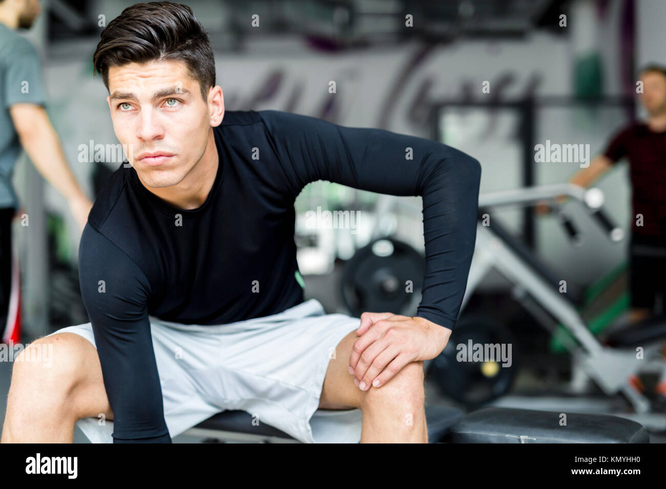 Young man training in a gym Stock Photo - Alamy