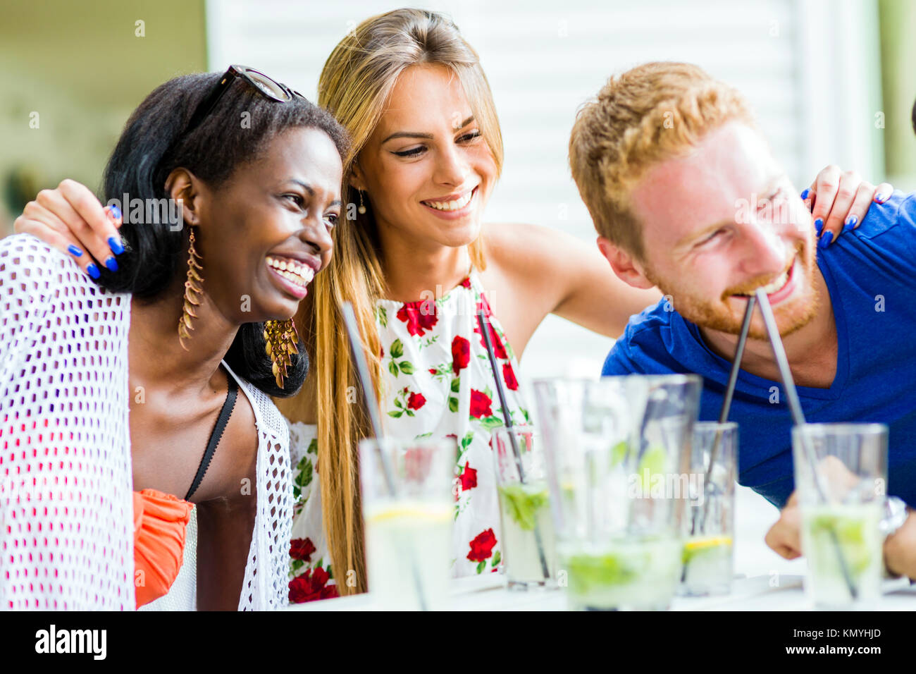 Women laughing restaurant table hi-res stock photography and images - Alamy