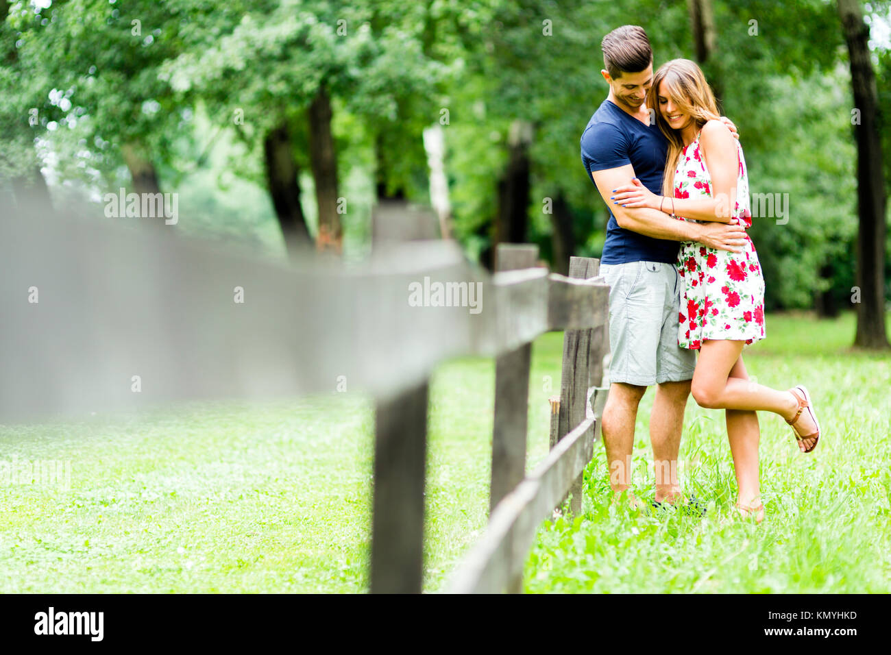 Couple embrace other love park hi-res stock photography and images - Alamy