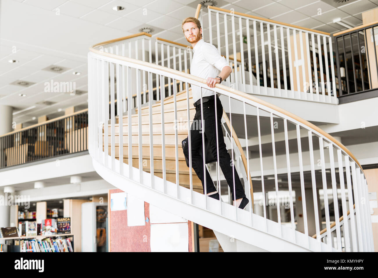 Businessman walking down stairs hi-res stock photography and images - Alamy