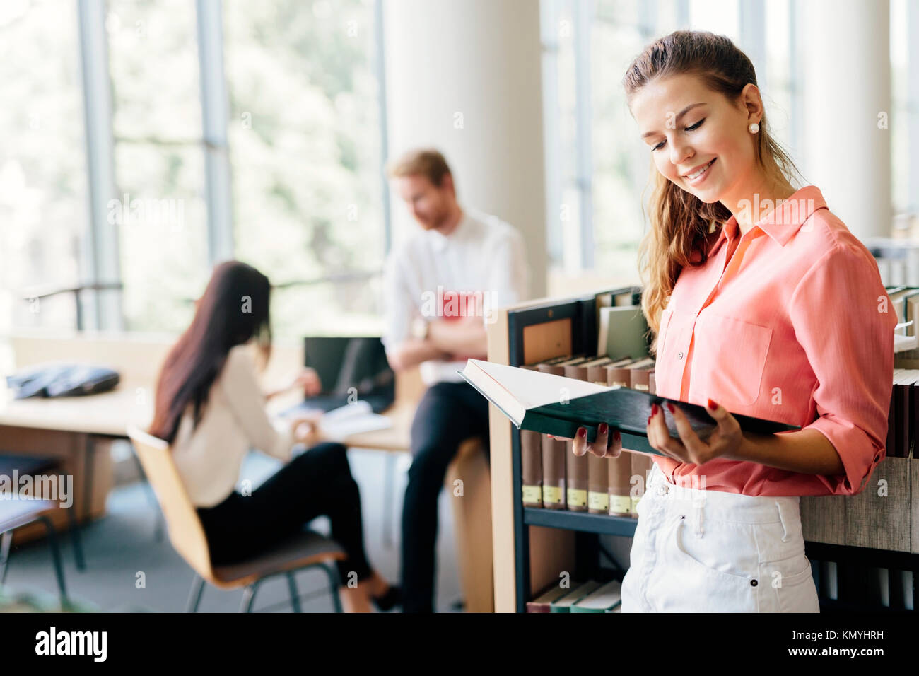 Female library book shelf hi-res stock photography and images - Alamy