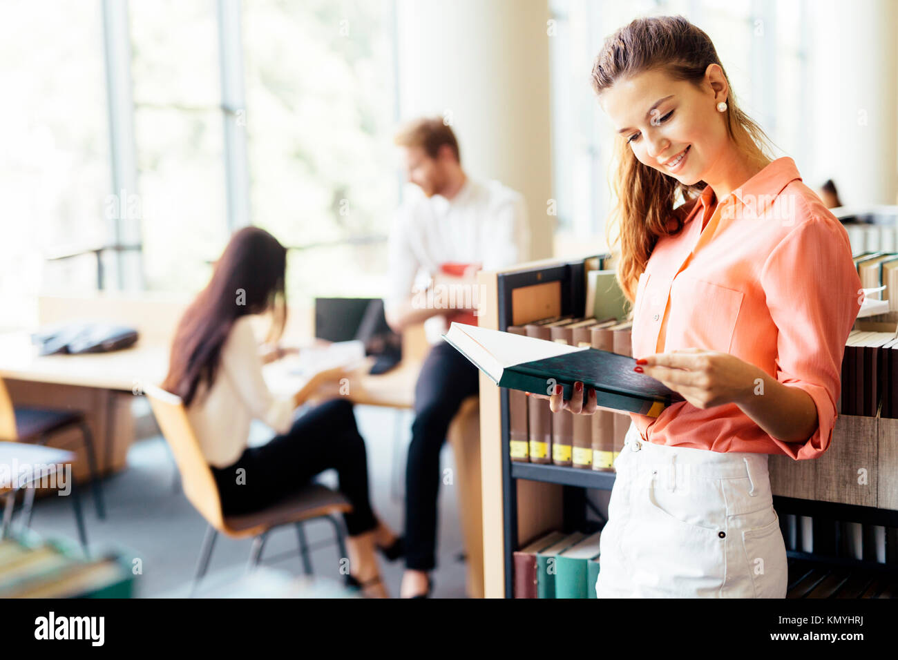 Female library book shelf hi-res stock photography and images - Alamy