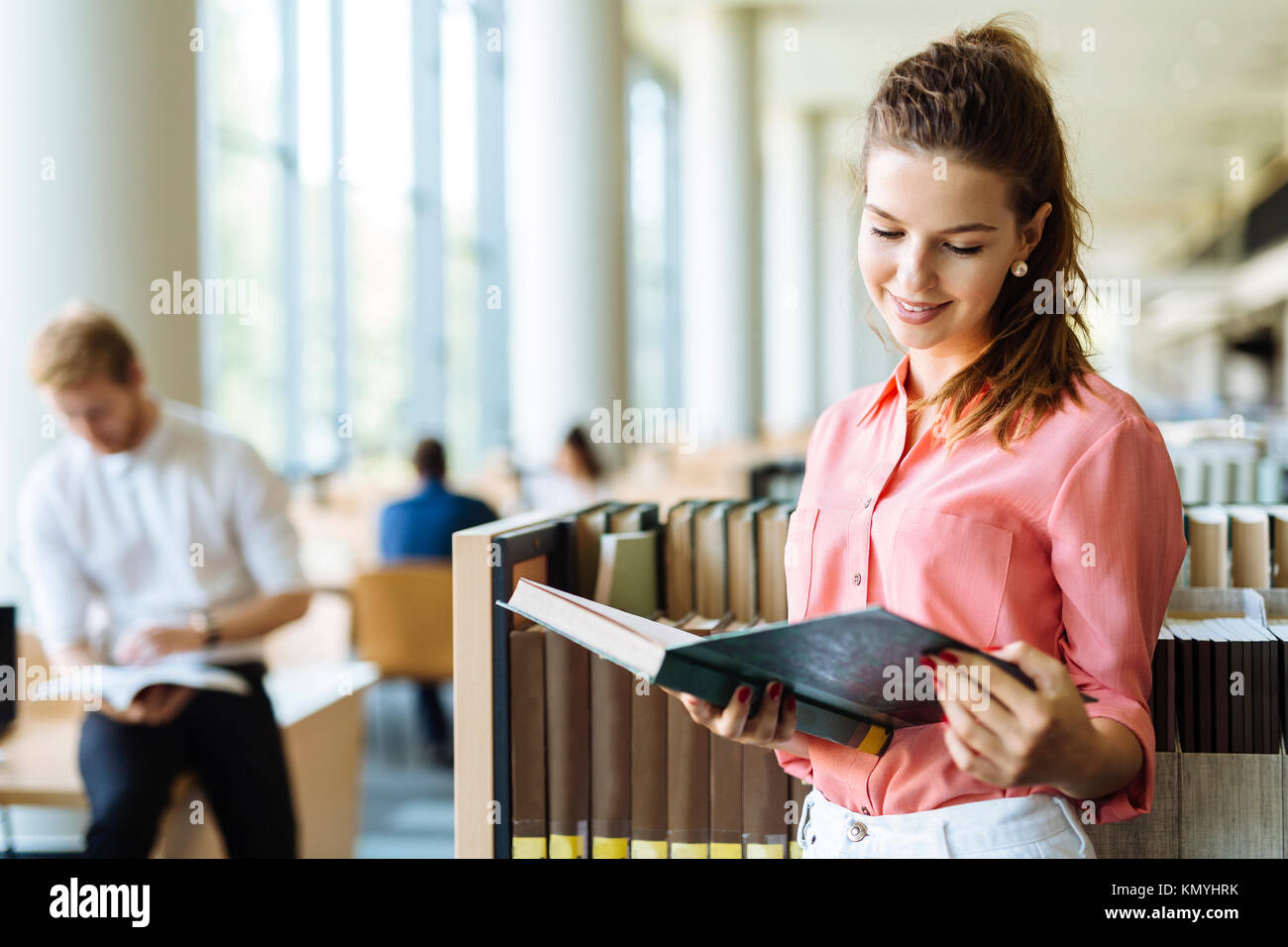 Beautiful girl in library hi-res stock photography and images - Alamy
