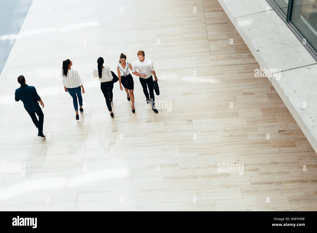 Young business people before starting work Stock Photo - Alamy