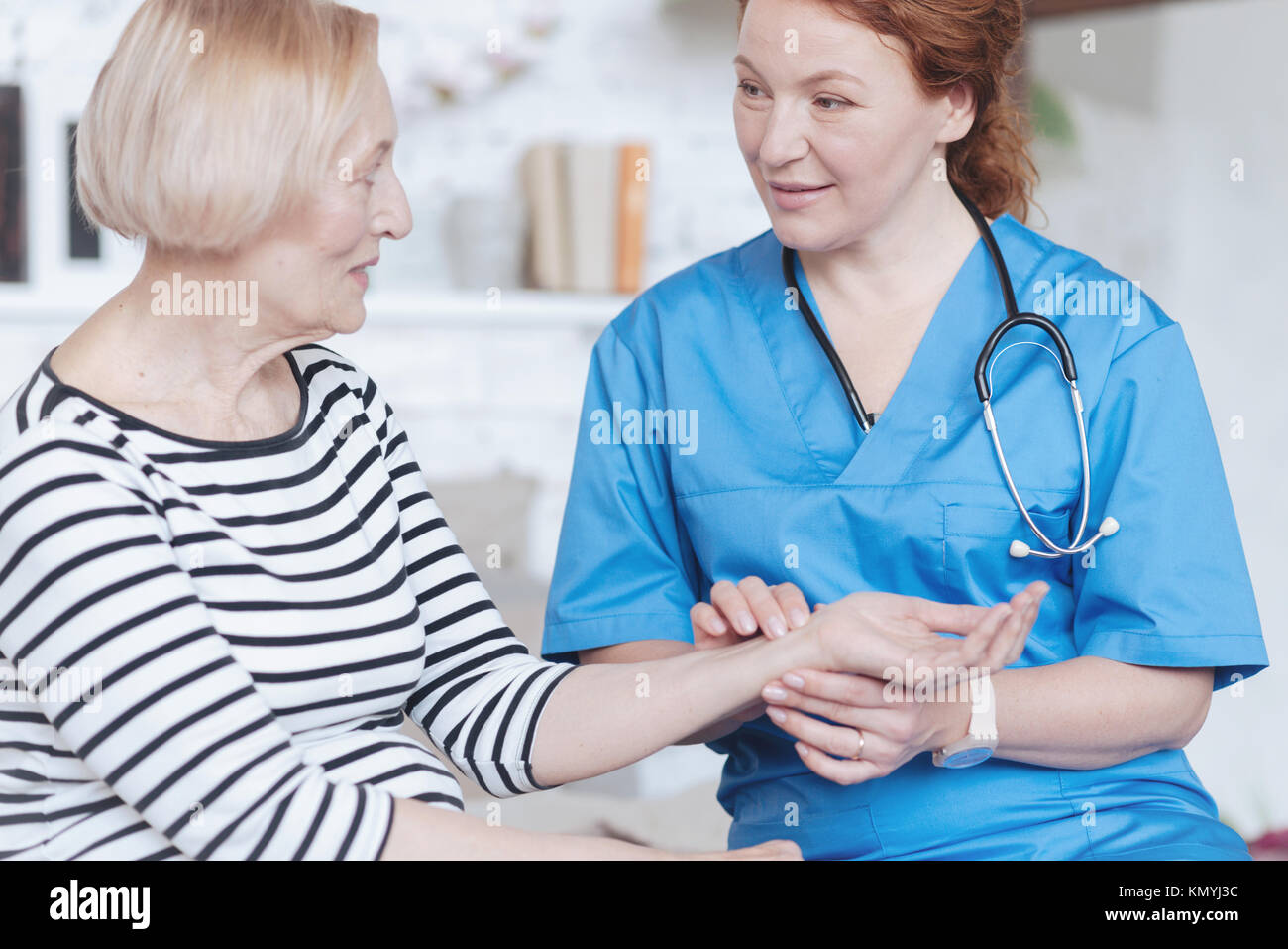 Checking pulse hand woman hi-res stock photography and images - Alamy