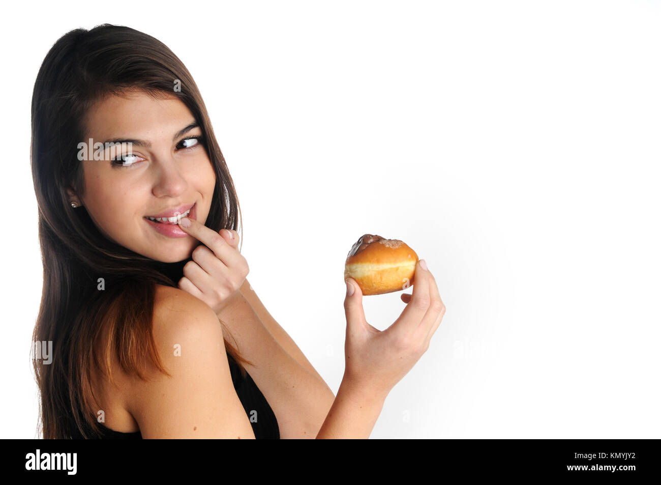 Eating sweet doughnut ( Sufganiyah) a traditional Jewish Doughnut eaten ...