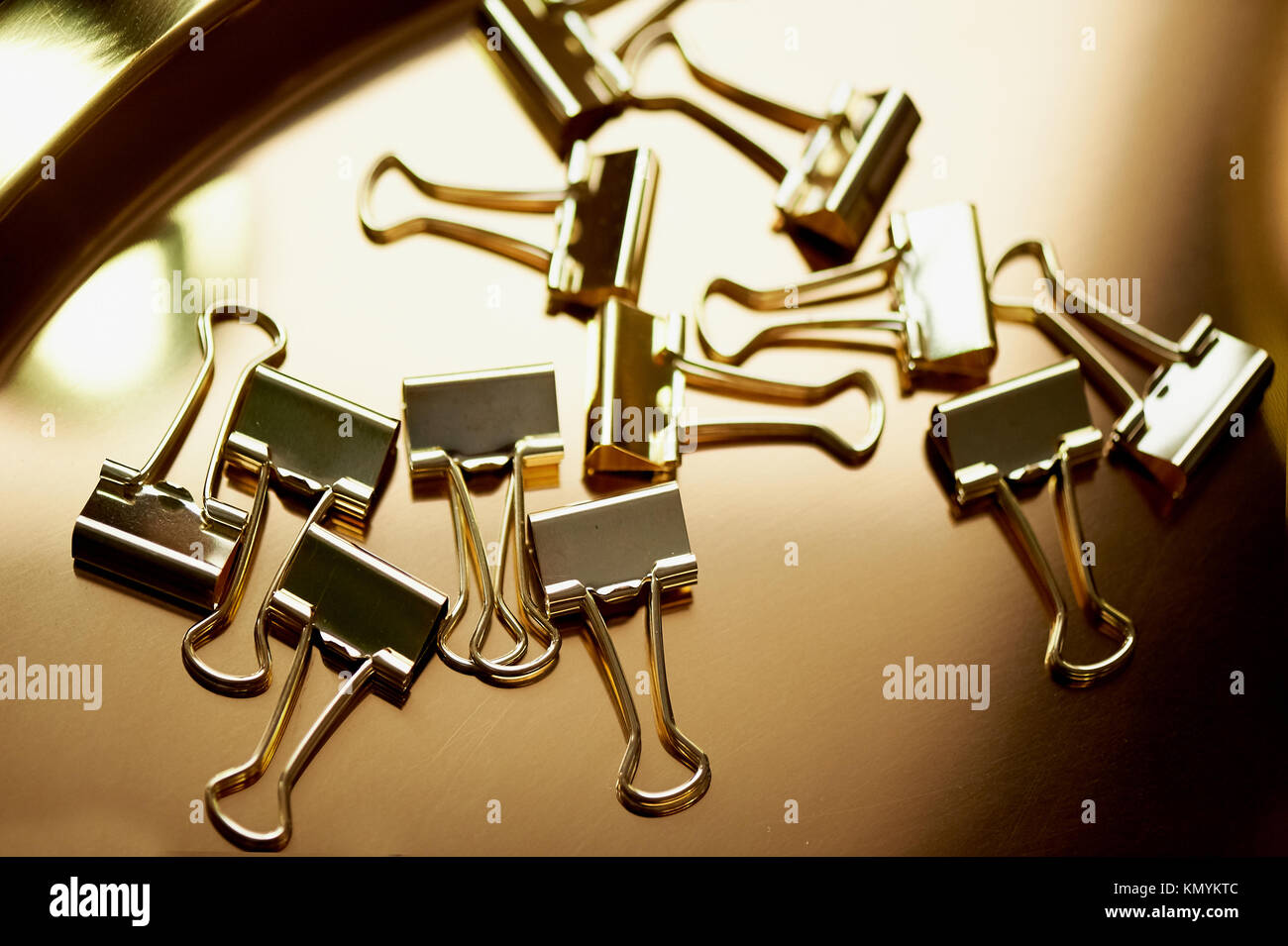 stationery gold pin on a gold background. Luxury office for business ...