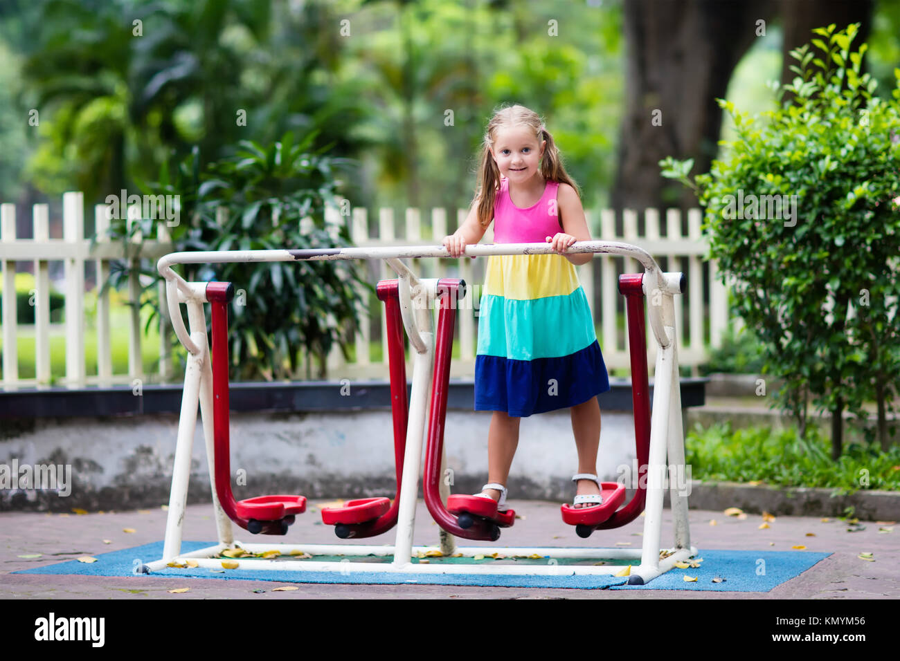 Kids on playground. Children play in summer park. Child on slide and ...