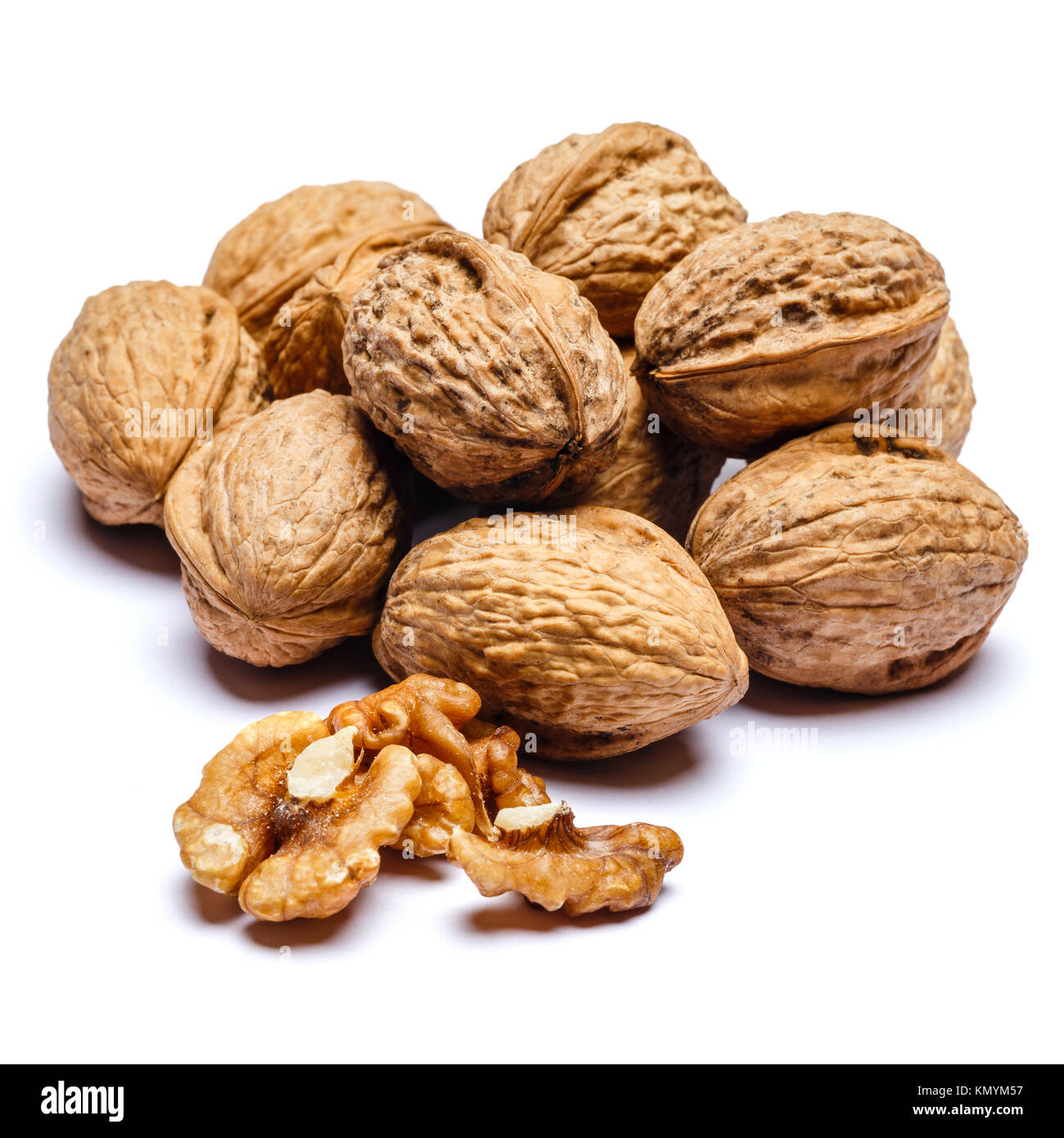 pile of walnuts isolated on white background Stock Photo - Alamy