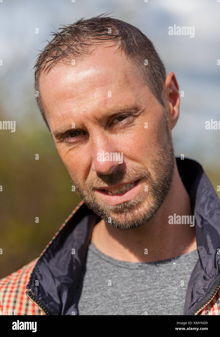 young man with checkered jacket portrait Stock Photo - Alamy