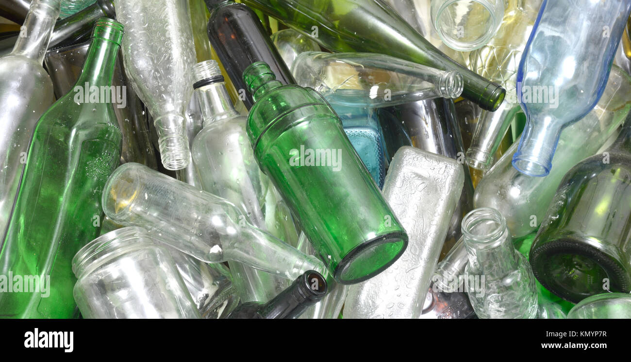 Glass bottles inside a glass recycling container Stock Photo - Alamy