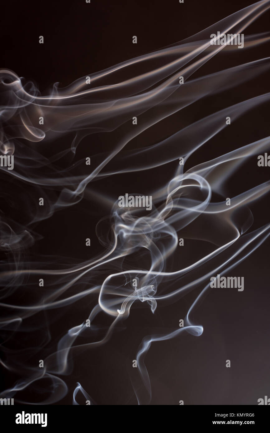 Incense on a black background. Smoke movement patterns of background ...