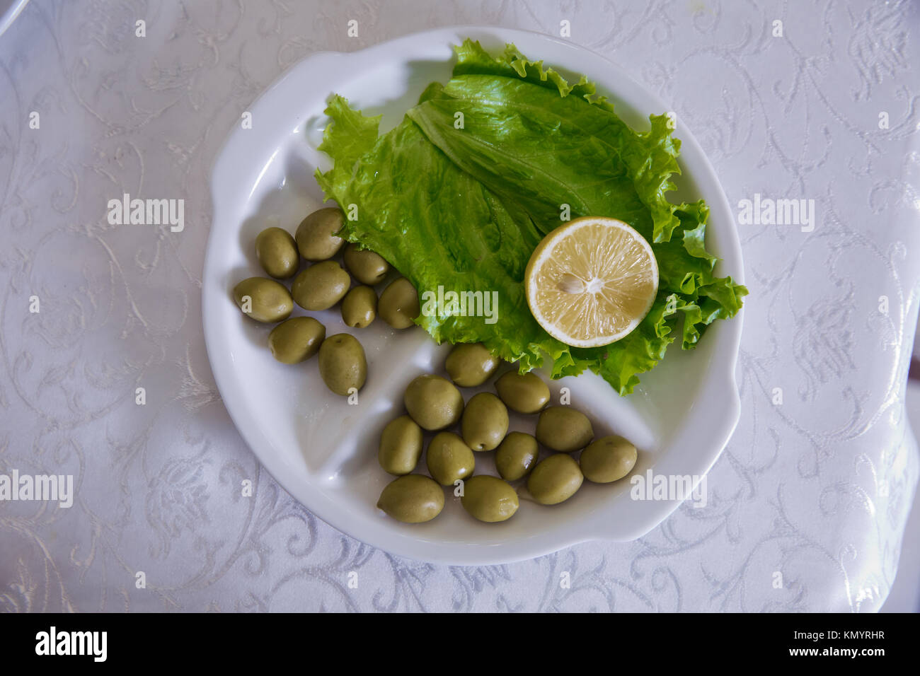 Cheese feta with olives . Olive capture . Olive grove Stock Photo - Alamy