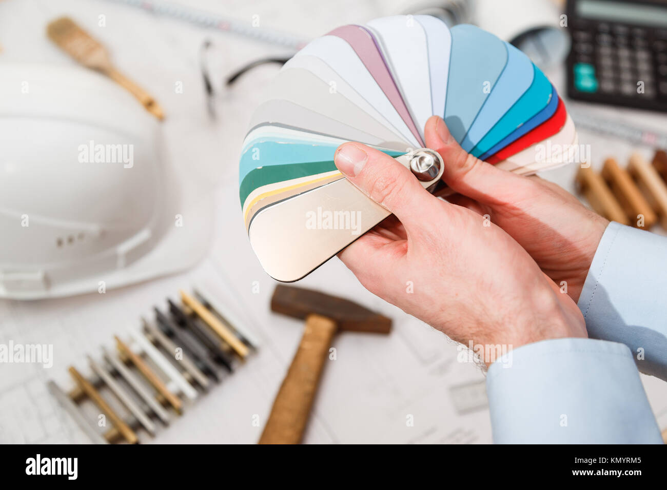 Architect interior's hands drawing home illustration with material ...