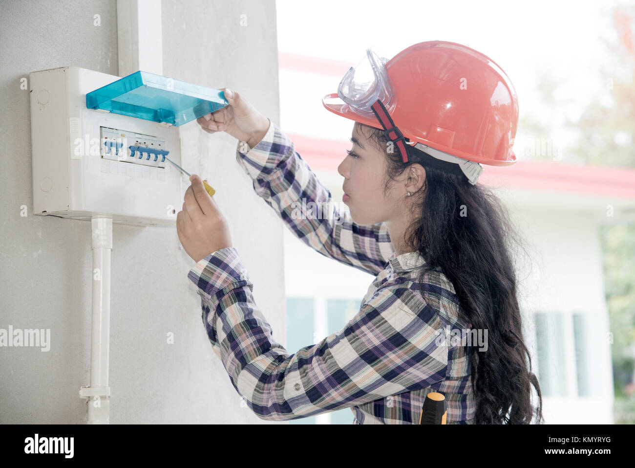Pretty Asian female Electrician or Engineer check or Inspect Electrical ...