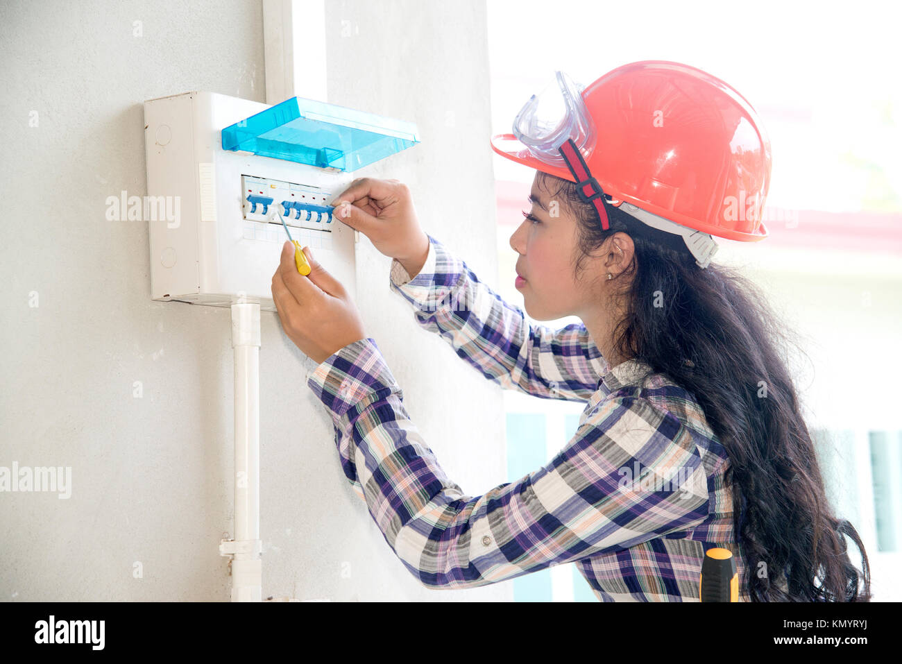 Pretty Asian female Electrician or Engineer check or Inspect Electrical ...
