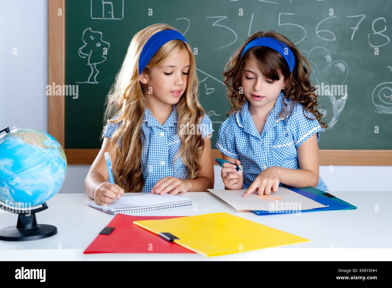 Students helping each other in class hi-res stock photography and ...