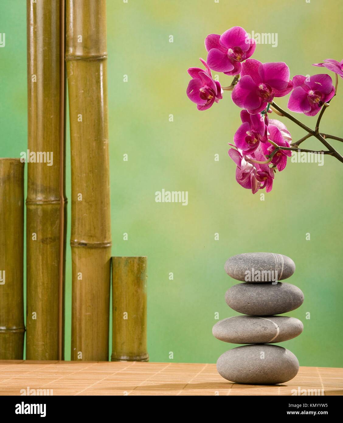 Stacked stones with flower Stock Photo - Alamy