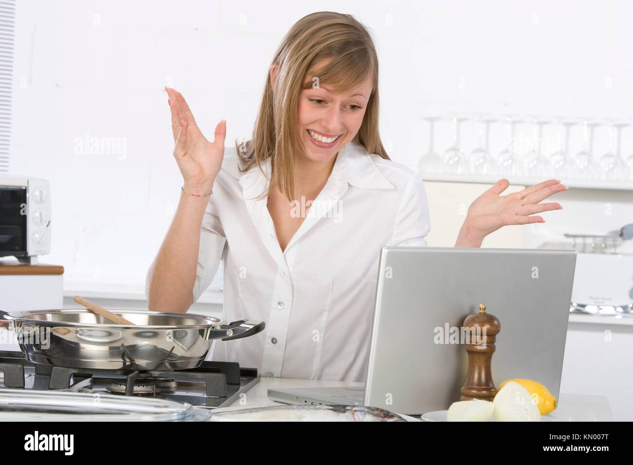 woman in the kitchen with computer Stock Photo - Alamy