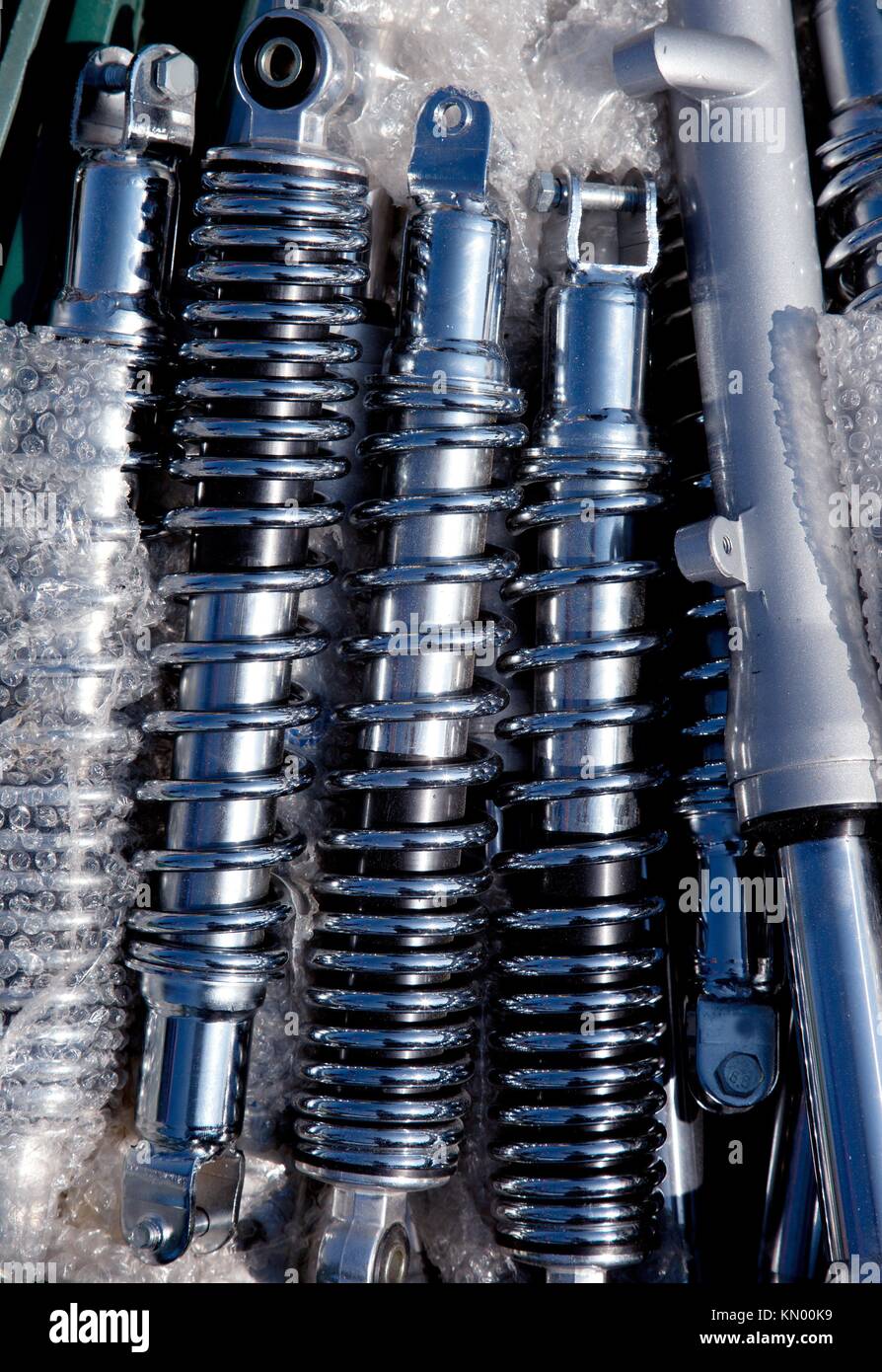 dampers in stainless steel silver chrome bike parts Stock Photo - Alamy