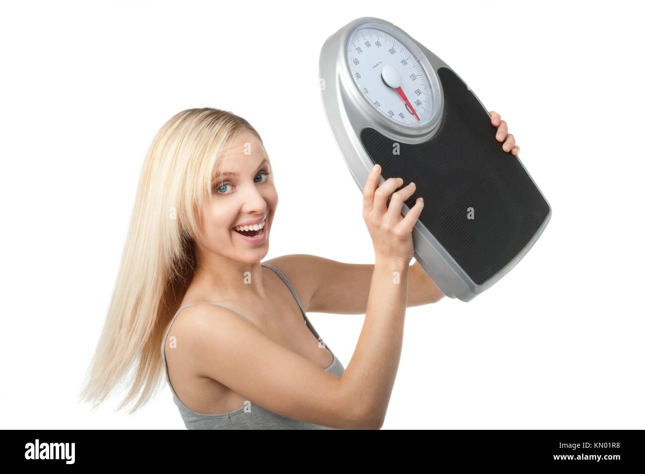 Young woman holding bathroom scale hi-res stock photography and images ...