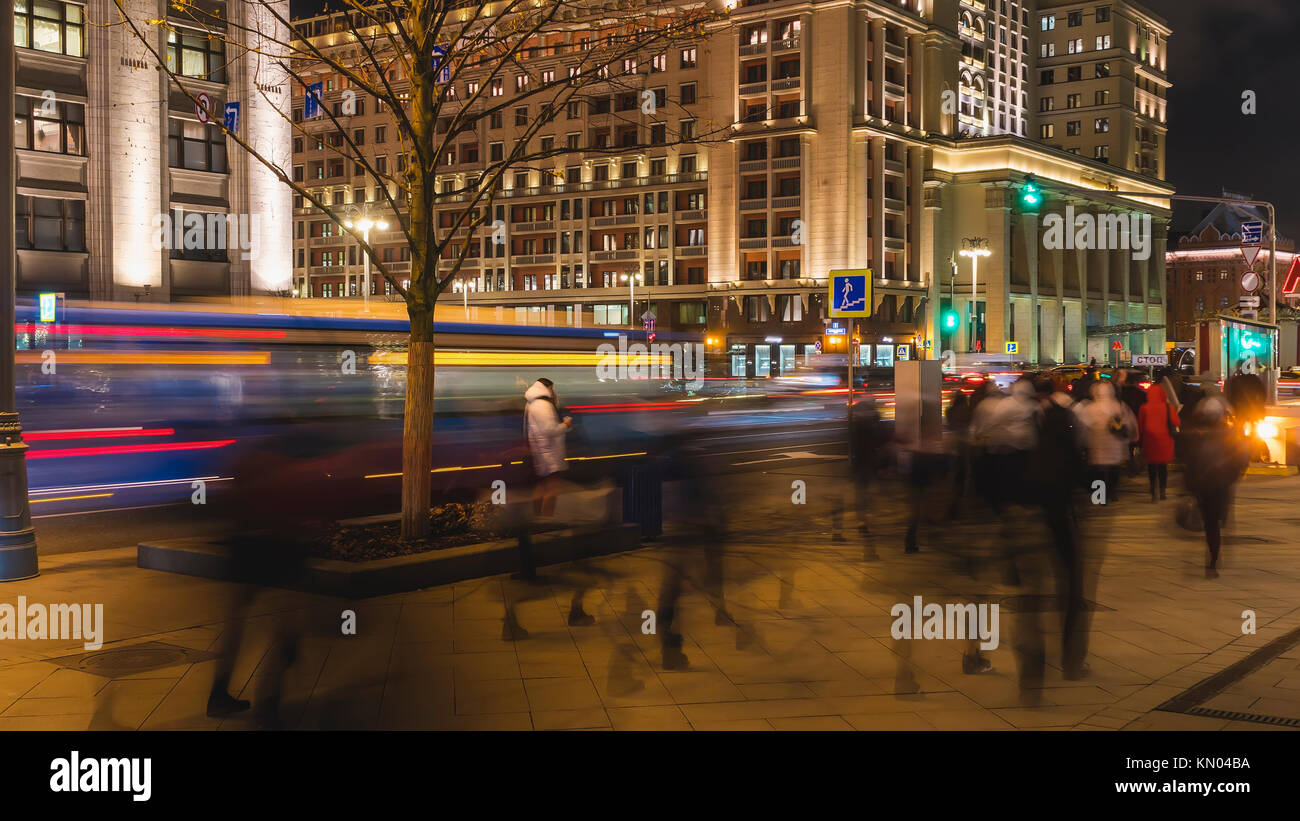 night traffic and the crowd of people on urban street Stock Photo - Alamy