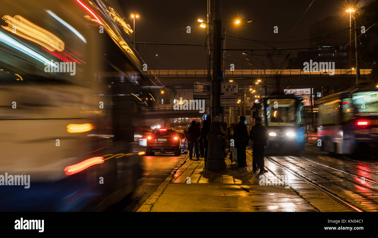 night traffic and the crowd of people on urban street Stock Photo - Alamy