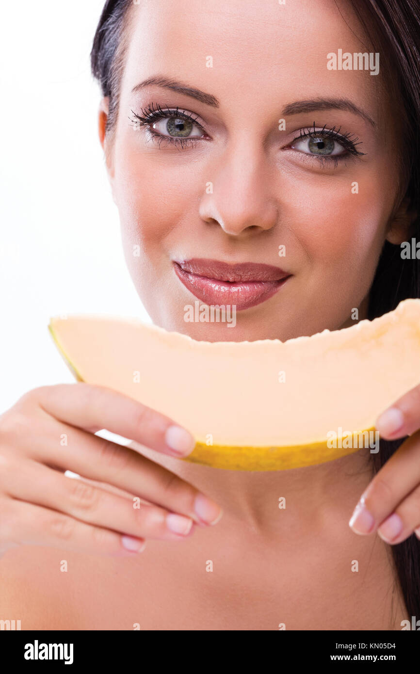 Beautiful woman with fresh melon Stock Photo - Alamy