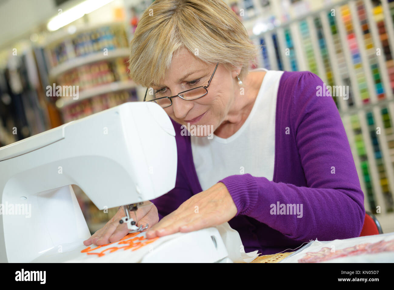 woman sewing using a sewing machine Stock Photo - Alamy
