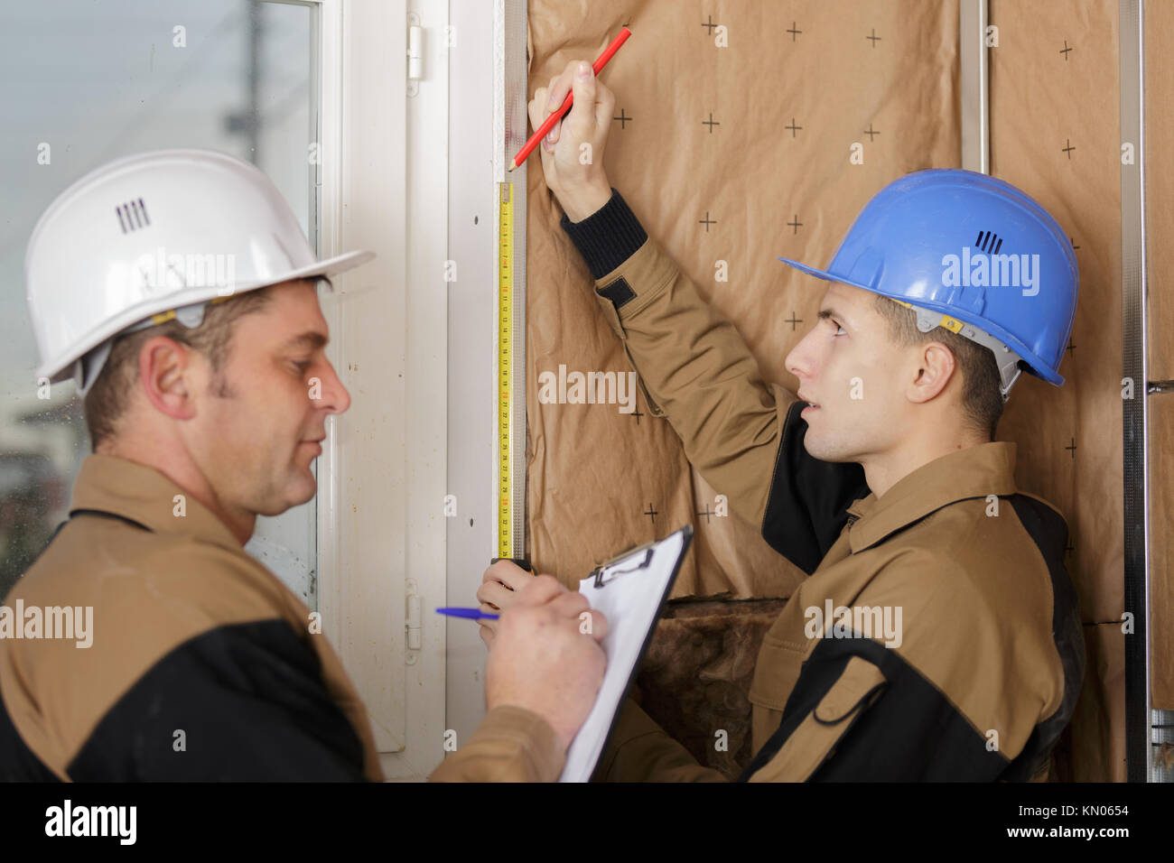 carpenter with apprentice during training period Stock Photo - Alamy