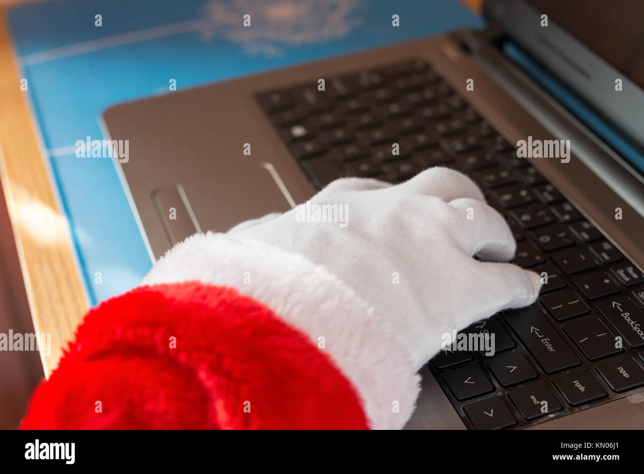 Santa Claus using laptop and typing on the keyboard Stock Photo - Alamy
