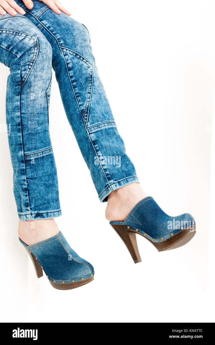 detail of woman wearing denim clogs Stock Photo - Alamy