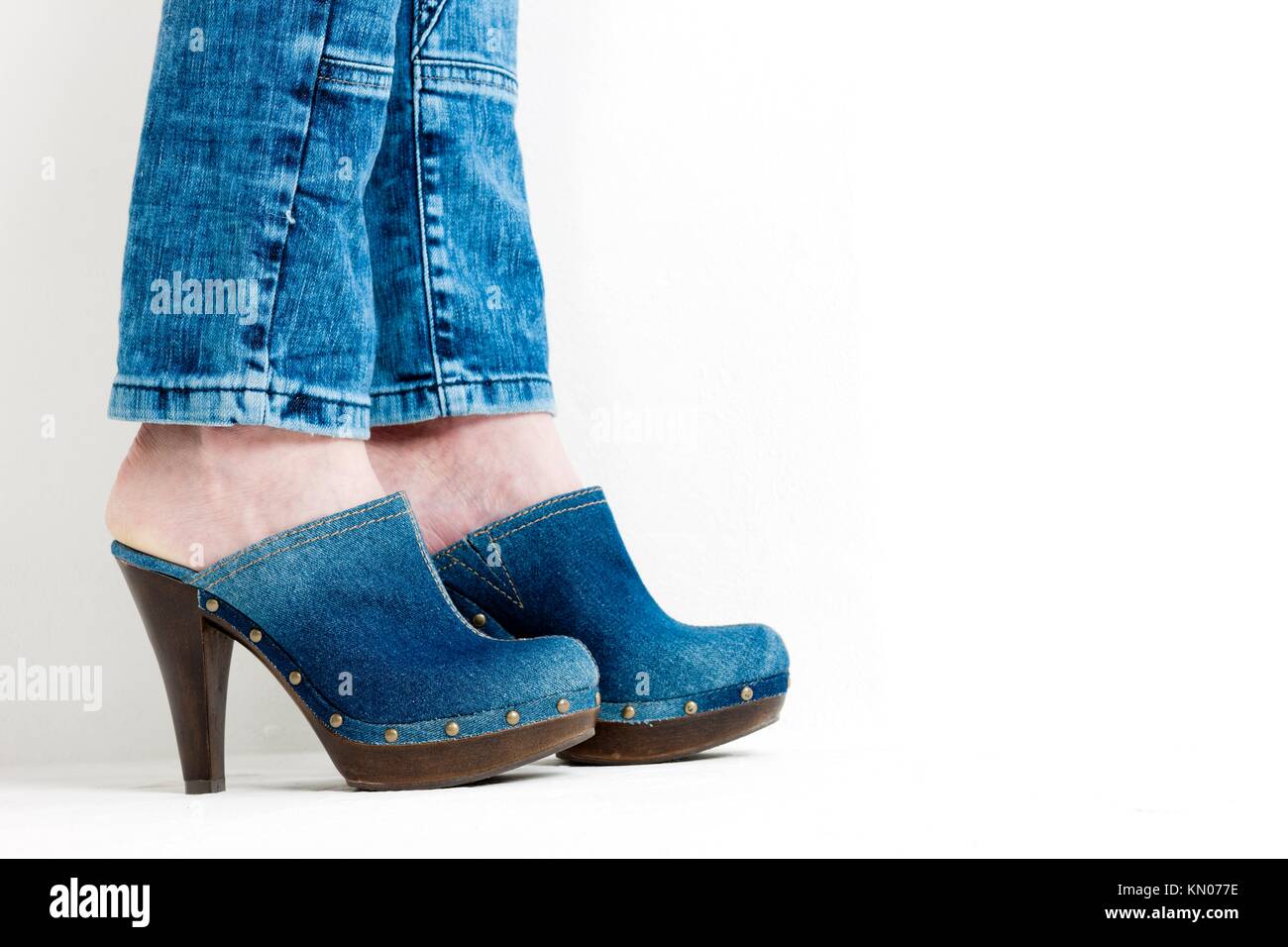 detail of woman wearing denim clogs Stock Photo - Alamy