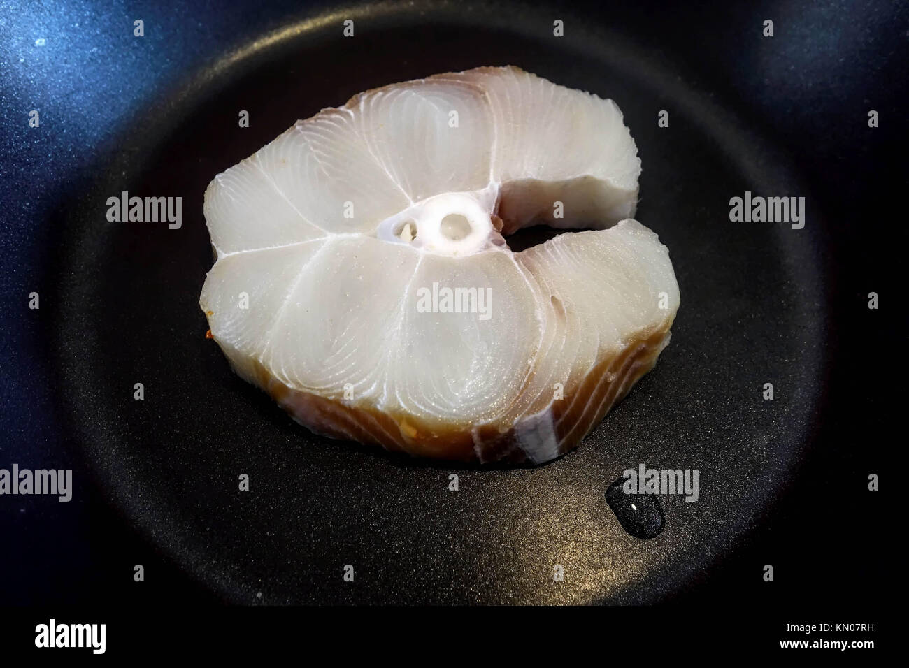 Blue Shark Fillet in a Frying Pan ready to be be cooked with Oil and ...