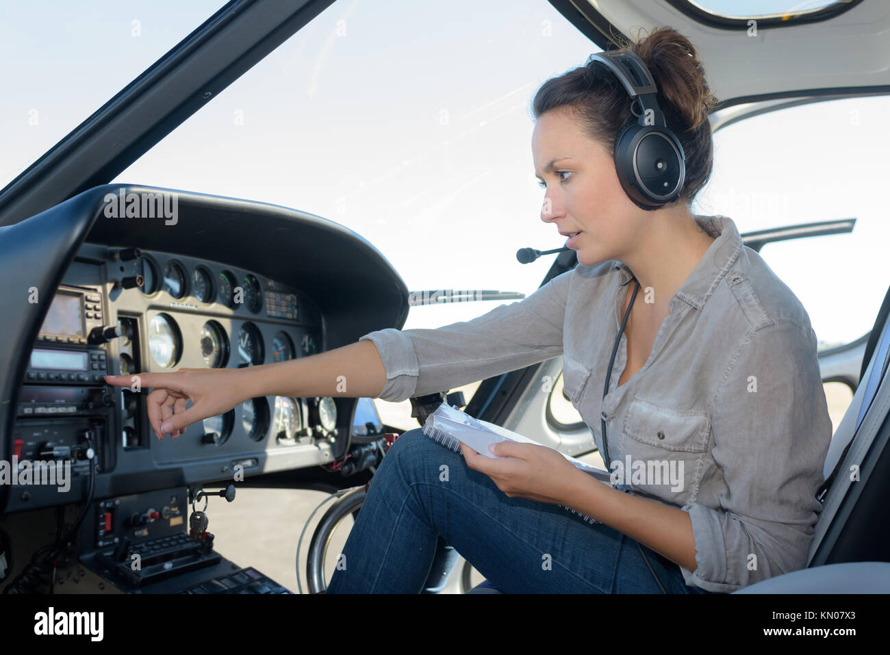 woman pilots flying a helicopter Stock Photo - Alamy