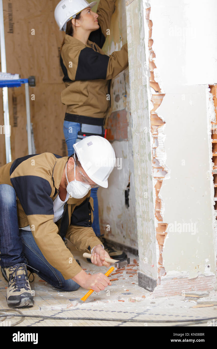 female engineer and specialist making wall plane Stock Photo - Alamy