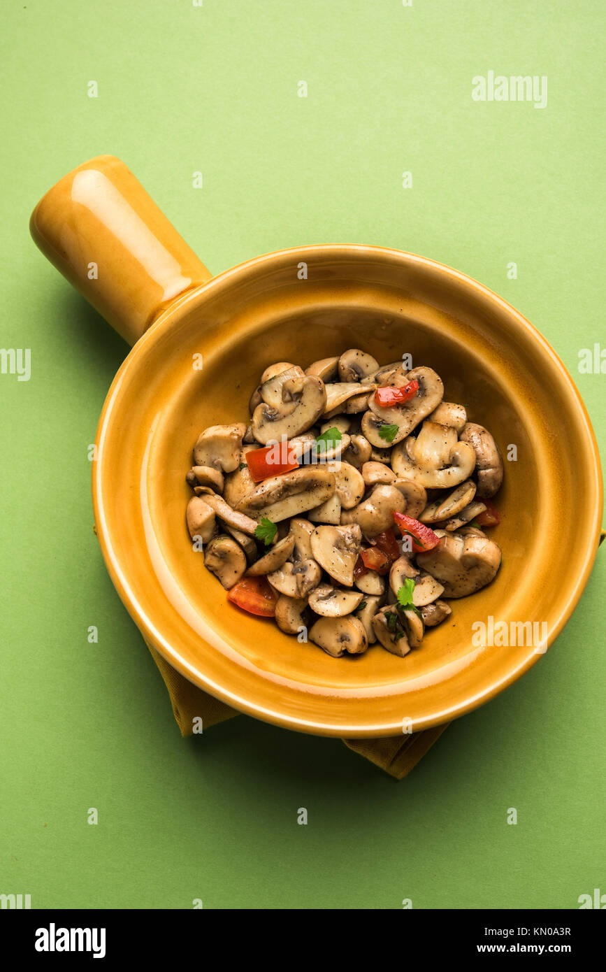 Mushroom Fry or sauteed mushroom or masharoom served in a bowl or in a ...