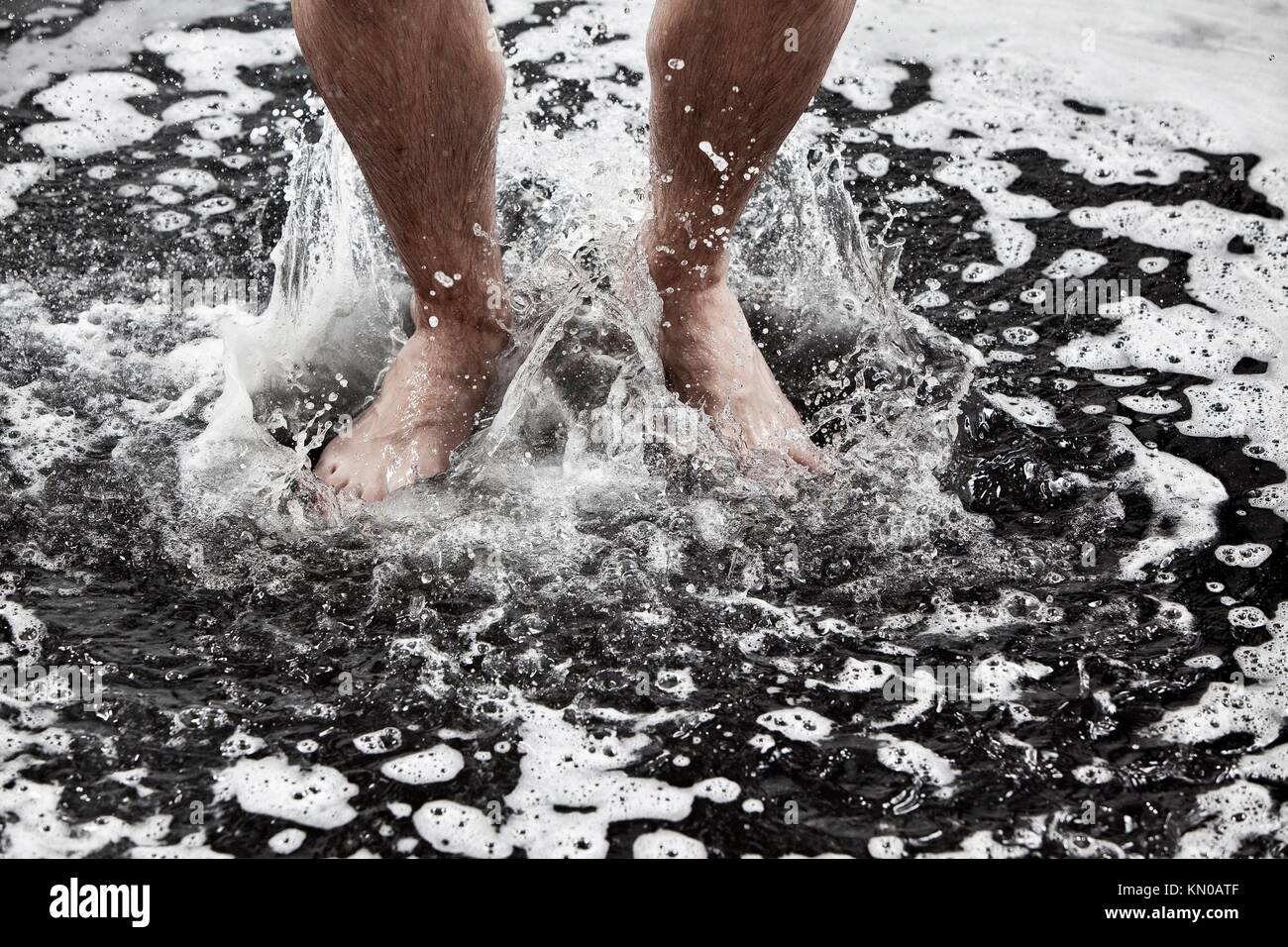 Concept human feet in water hi-res stock photography and images - Alamy