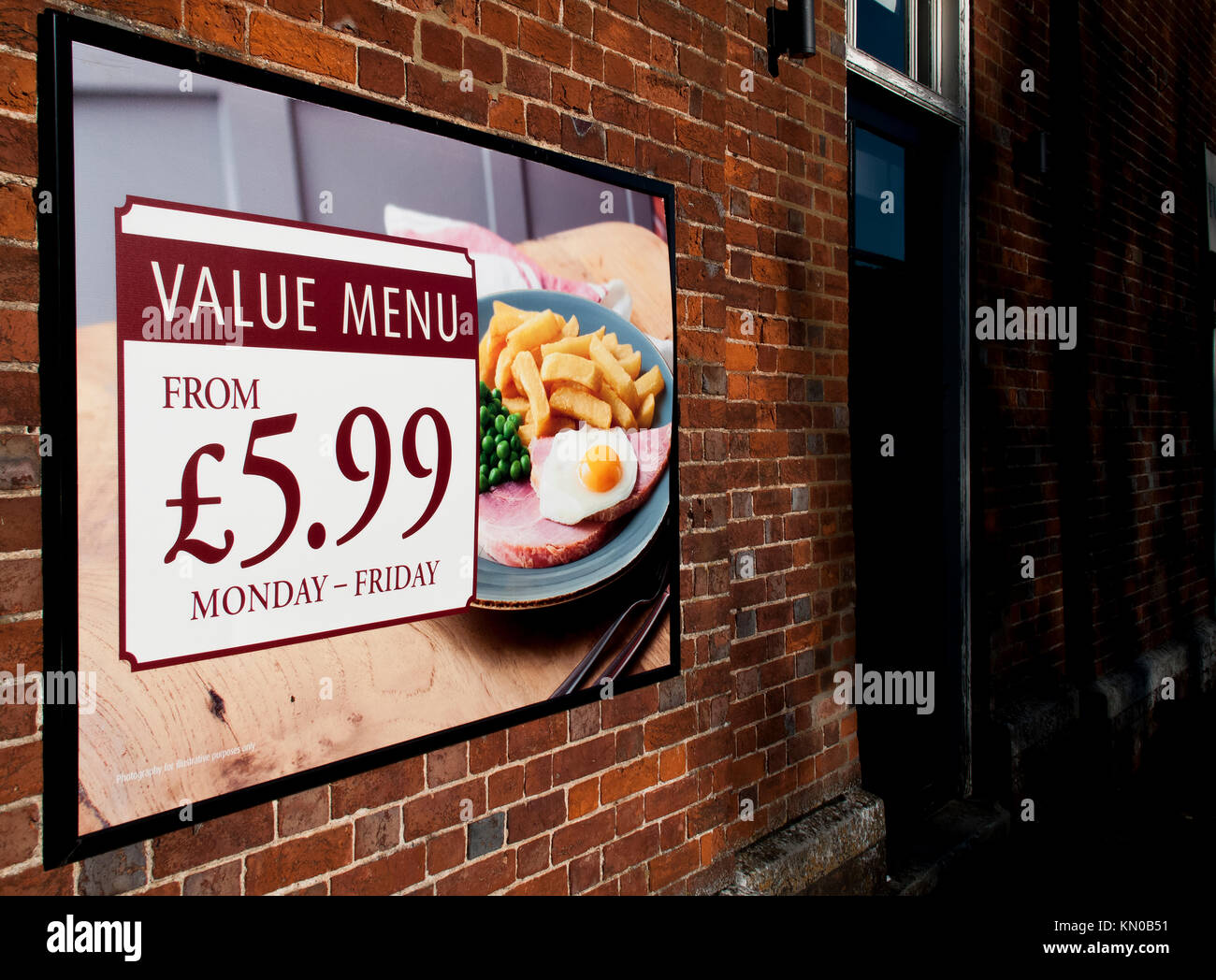 Value menu advertising poster on side wall of public house Stock Photo ...