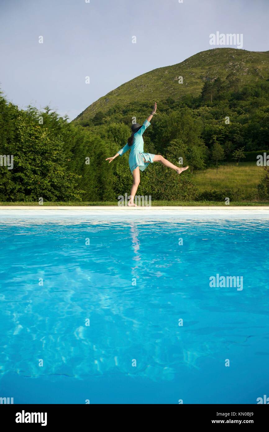 woman barefoot at swimming pool border in Asturias Spain Stock Photo ...