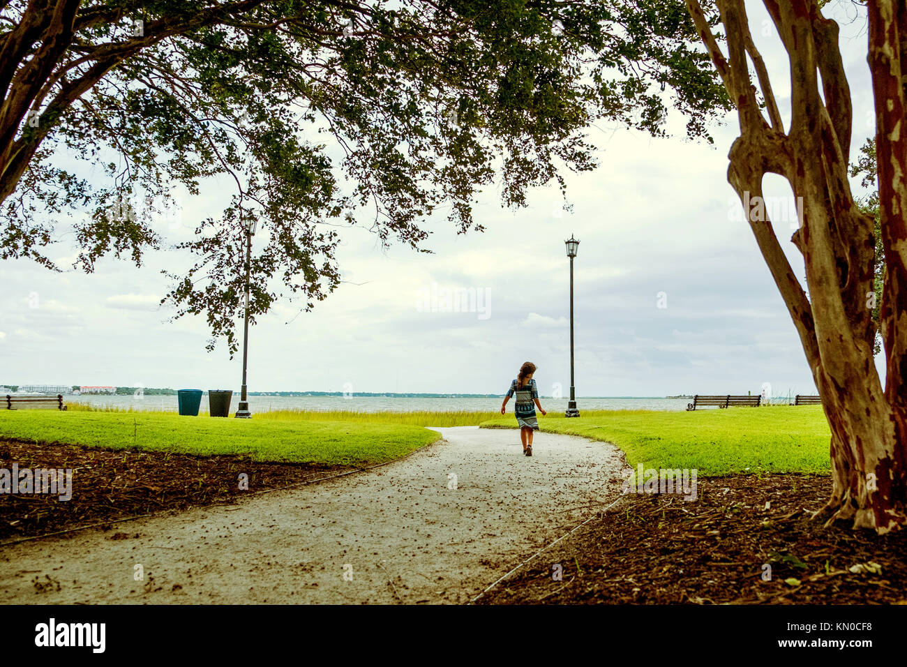 a young girl enjoying day at the park Stock Photo - Alamy