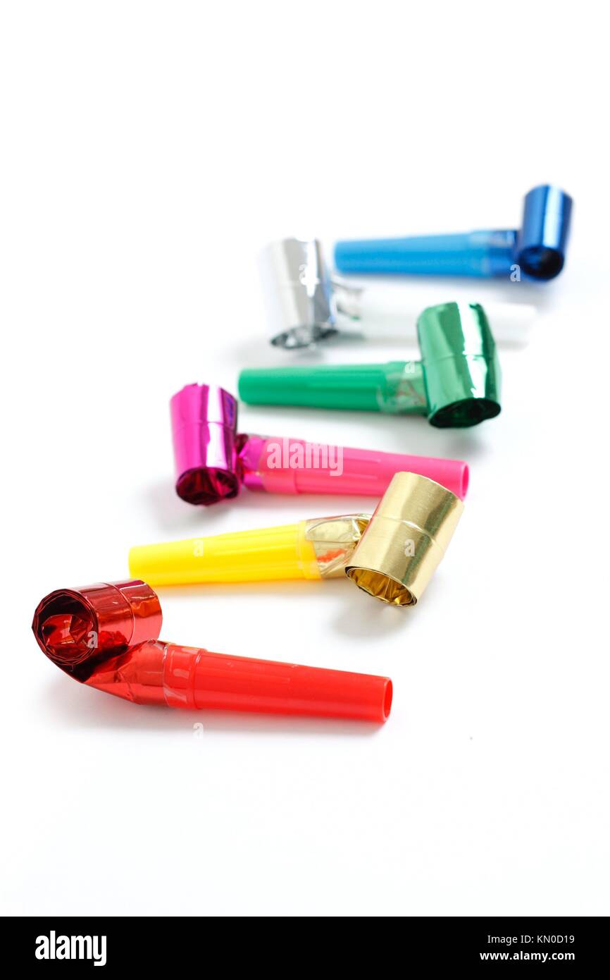 Party blowers isolated on white Stock Photo - Alamy