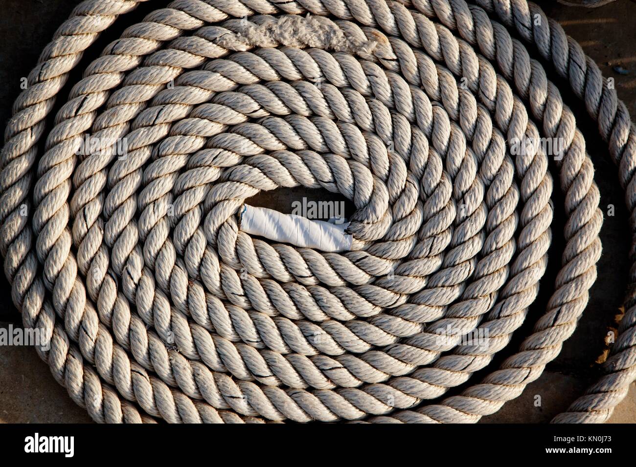coil of marine rope detail in marina port Stock Photo - Alamy