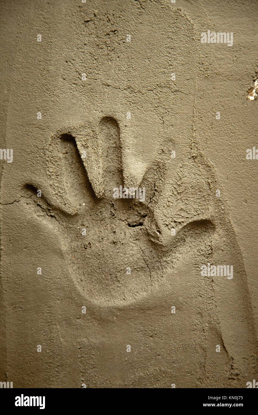 hand print on cement mortar wall with shadow relief Stock Photo - Alamy