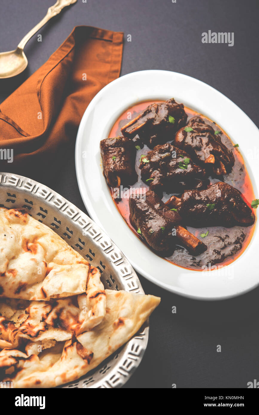 lamb shank or mutton or gosht paya or khoor curry served with indian ...